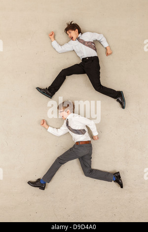 Business people running in opposite direction Stock Photo - Alamy