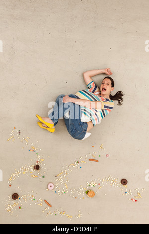Woman falling above food Stock Photo - Alamy