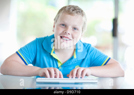 Boy using a glass digital tablet against white background Stock Photo ...