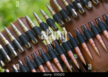 Machine gun bullets in belt fed through gun. War and Peace Revival ...