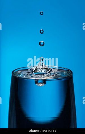 Closeup of water splashing in a glass Stock Photo - Alamy