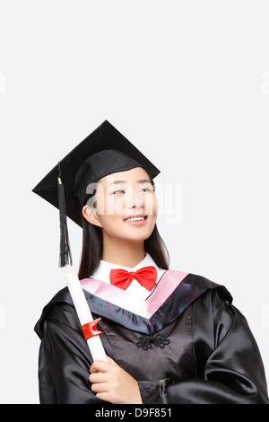 Cheerful young woman get graduation in university campus Stock Photo ...