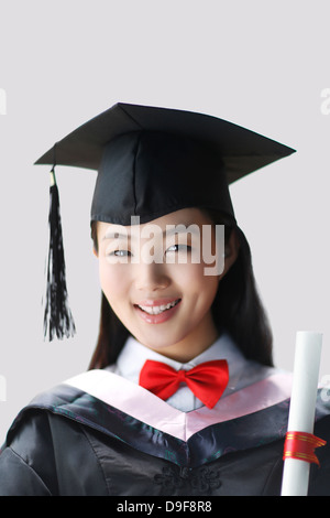 Young woman graduation and smile to camera Stock Photo - Alamy
