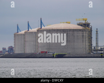 LNG import terminal Tanks for liquid natural gas in the seaport of Rotterdam, harbour tug ...