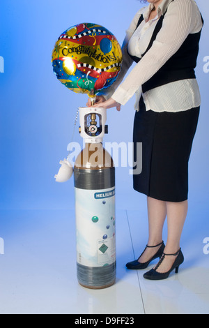filling Helium party balloons from cylinders Stock Photo - Alamy