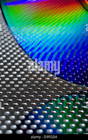 DVD, CD-ROM or Blu-Ray disc with tv or disc player remote control on ...