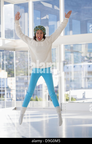 Image of excited beautiful woman posing with hands on her chest ...