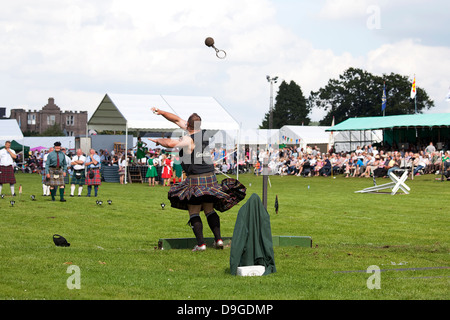 Man weight throw event in Scottish Highland games Stock Photo - Alamy