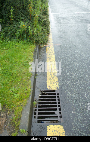 Heavy rain falling on road Stock Photo - Alamy