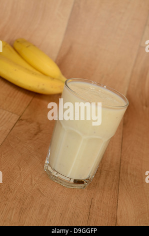 Fresh bananas on wooden background Stock Photo - Alamy