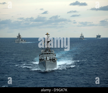 USS Nimitz leads a formation of ships from the Indian Navy and Japan ...