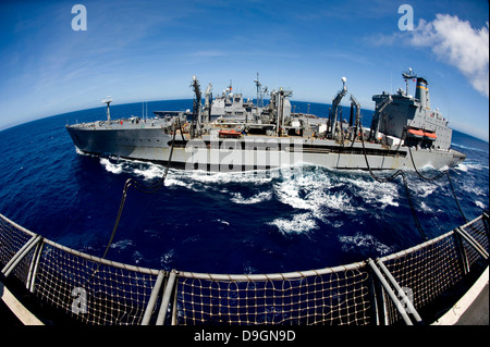 The fleet replenishment oiler USNS Walter S. Diehl (T-AO 193), right ...