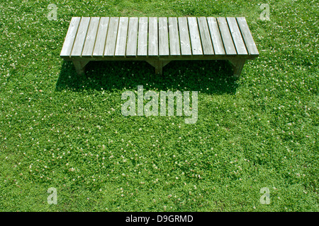Clover field and bench Stock Photo - Alamy