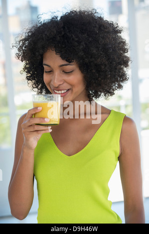 Woman eating mango Stock Photo - Alamy