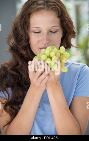 Young Woman Eating Red Grapes Model Released Stock Photo - Alamy