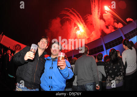 Fans celebrate with fireworks during the Erdinger Champ Party at the ...