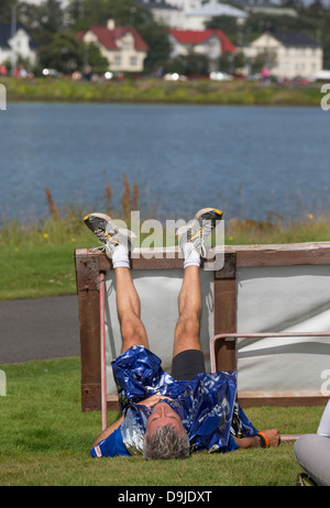 A runner wrapped in a foil blanket Stock Photo - Alamy