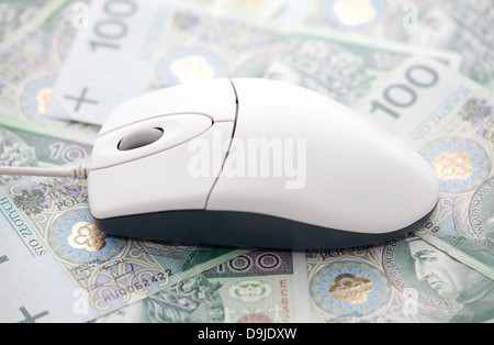 Computer mouse on polish money with clipping path Stock Photo - Alamy