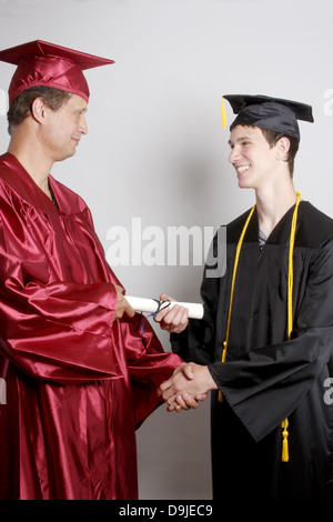 Shaking hands, graduation and certificate for college student with ...
