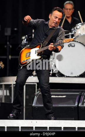 Bruce Springsteen plays guitar during the concert at the Ricoh Arena ...