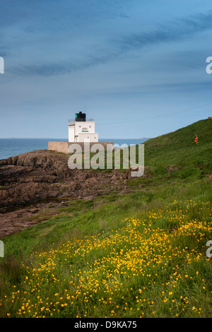 The lighthouse at Harkness Rocks, Bamburgh, Northumberland, England, UK ...