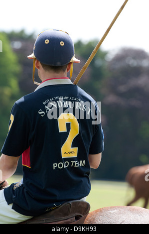Polo player wearing helmet Stock Photo - Alamy
