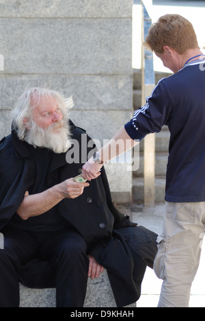Close up view of homeless man washing hands under running water Stock ...