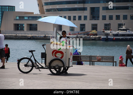A street vendor selling refreshments to tourists near the Colosseum ...