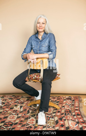 Woman in white t-shirt and black sunglasses drinking warm tea in the ...
