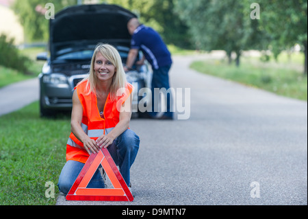 Breakdown with a passenger car (model release Stock Photo - Alamy