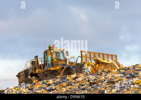 Heavy equipment pushing garbage at a sanitary landfill Stock Photo - Alamy