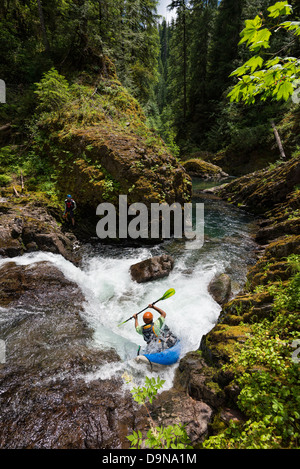 Paddling an inflatable kayak down a waterfall, Fall Creek, Oregon Stock ...