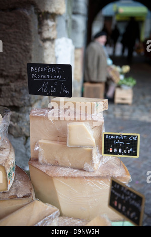 Stand selling Beaufort mountain cheese at Annecy's old town market ...
