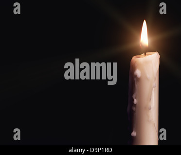 Closeup shot of a candle with black background Stock Photo - Alamy