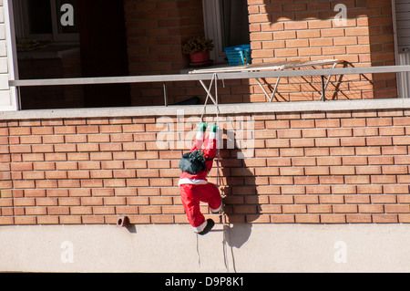 Santa Claus slipping on a balcony to leave gifts next to the fireplace ...