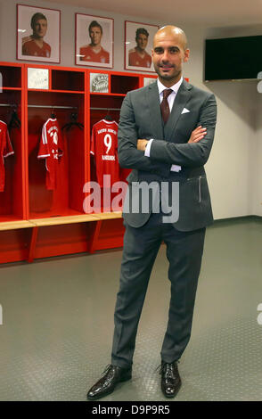New FC Bayern Muenchen Head Coach Pep Guardiola walks past pictures of ...