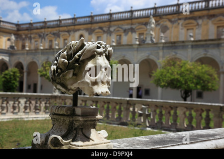 Skull on the balustrades in the monastic cemetery, Great Cloister of ...