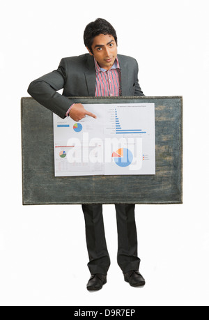 The businessman standing on pie chart in business concept Stock Photo ...