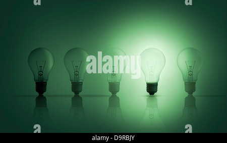 Row of Light Bulbs with One Lit Up Stock Photo - Alamy