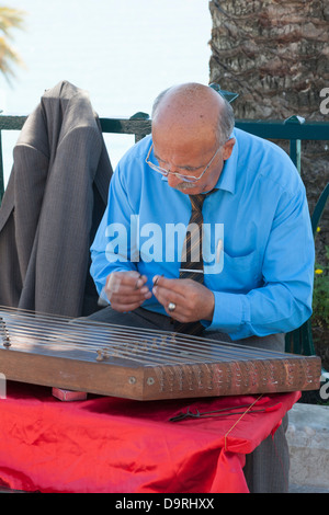 Man playing musical instrument santoor India Stock Photo - Alamy