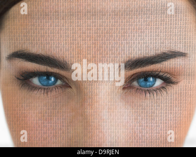 Attractive blue eyed woman with binary code on face close up staring at ...
