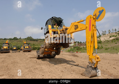 JCB racing and stunts in Diggerland Strood Kent Stock Photo - Alamy