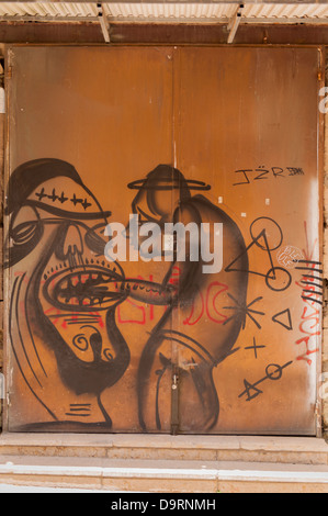Israel Old Jaffa Jafo graffiti head of man with hat on wall street art ...