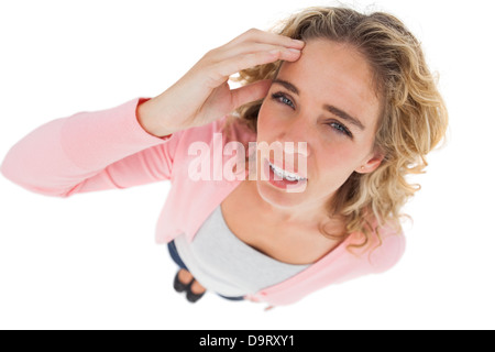 Overhead of attractive woman touching her forehead Stock Photo - Alamy