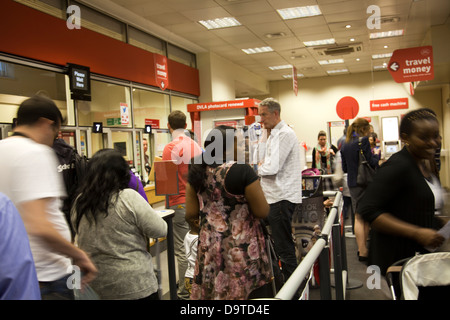 Queues of people inside an English Post Office, Newmarket Suffolk UK ...
