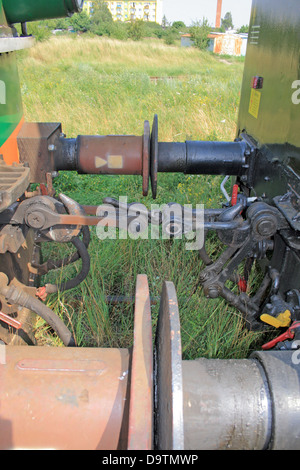 Chain coupling between locomotive and the wagons Stock Photo - Alamy