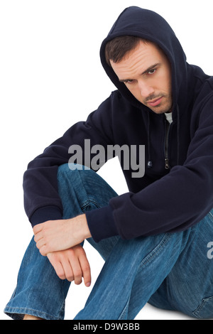 Sad man with hood sitting alone on bench in sunny weather, wearing ...