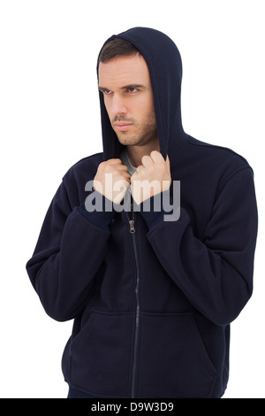 Angry looking man with his hood up Stock Photo - Alamy