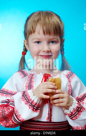Russian little girl eats homemade pie Stock Photo - Alamy
