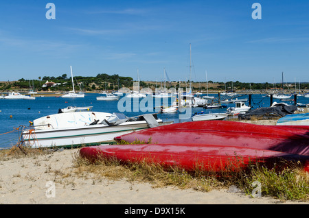 Boats moored in the estuary at the pretty town of Alvor in the Algarve ...